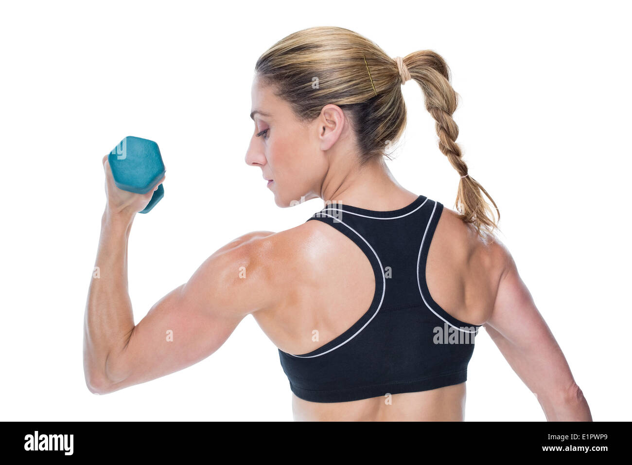 Female bodybuilder holding a dumbbell Stock Photo - Alamy