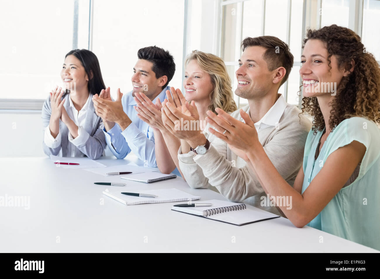 Casual business team clapping at presentation Stock Photo - Alamy