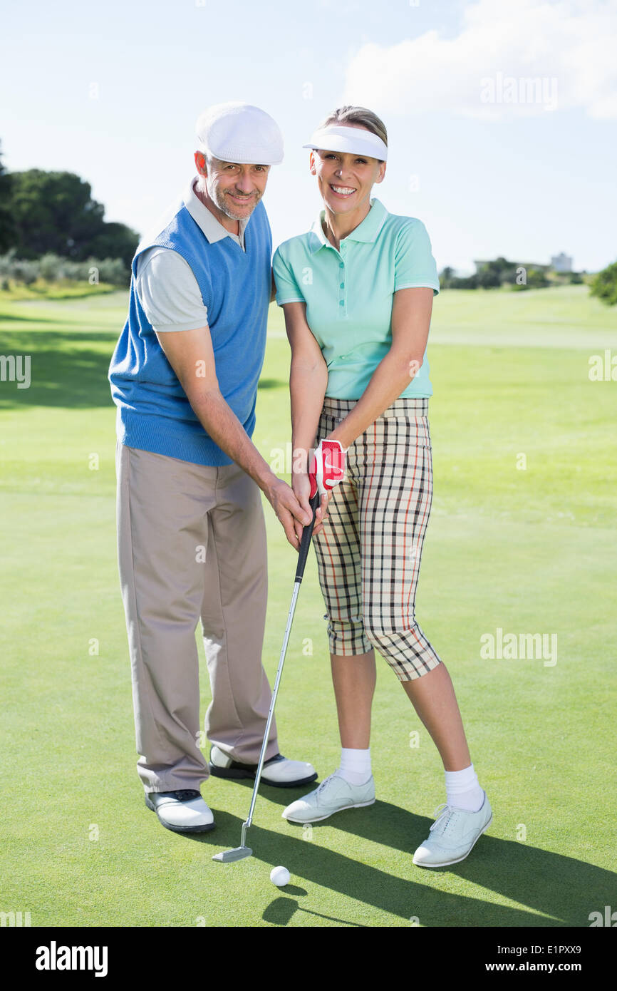 Happy couple putting the ball together Stock Photo - Alamy