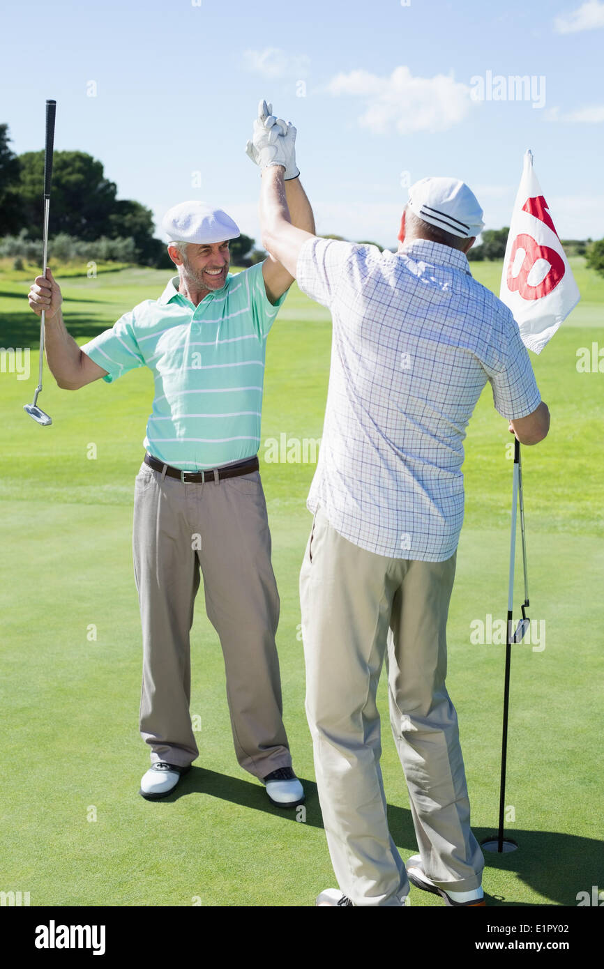 Friends high fiving hi-res stock photography and images - Alamy