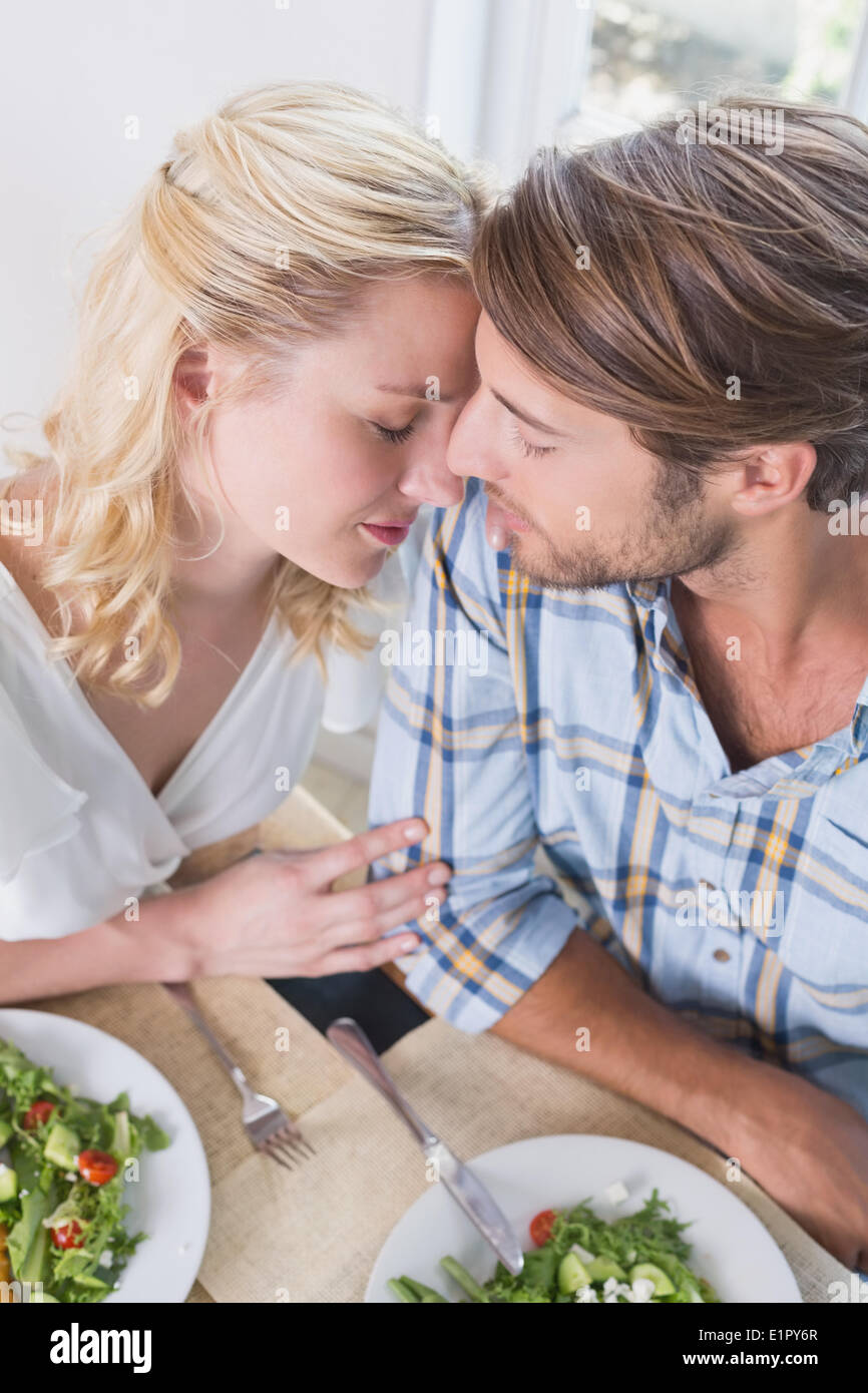 Couple kissing dinner table hi-res stock photography and images - Alamy