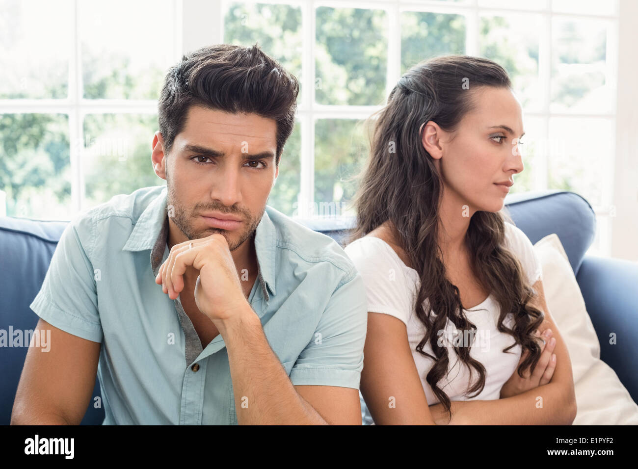 Attractive couple not talking on the couch Stock Photo - Alamy