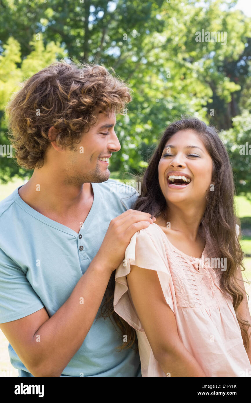 Cute couple relaxing on park bench Stock Photo - Alamy