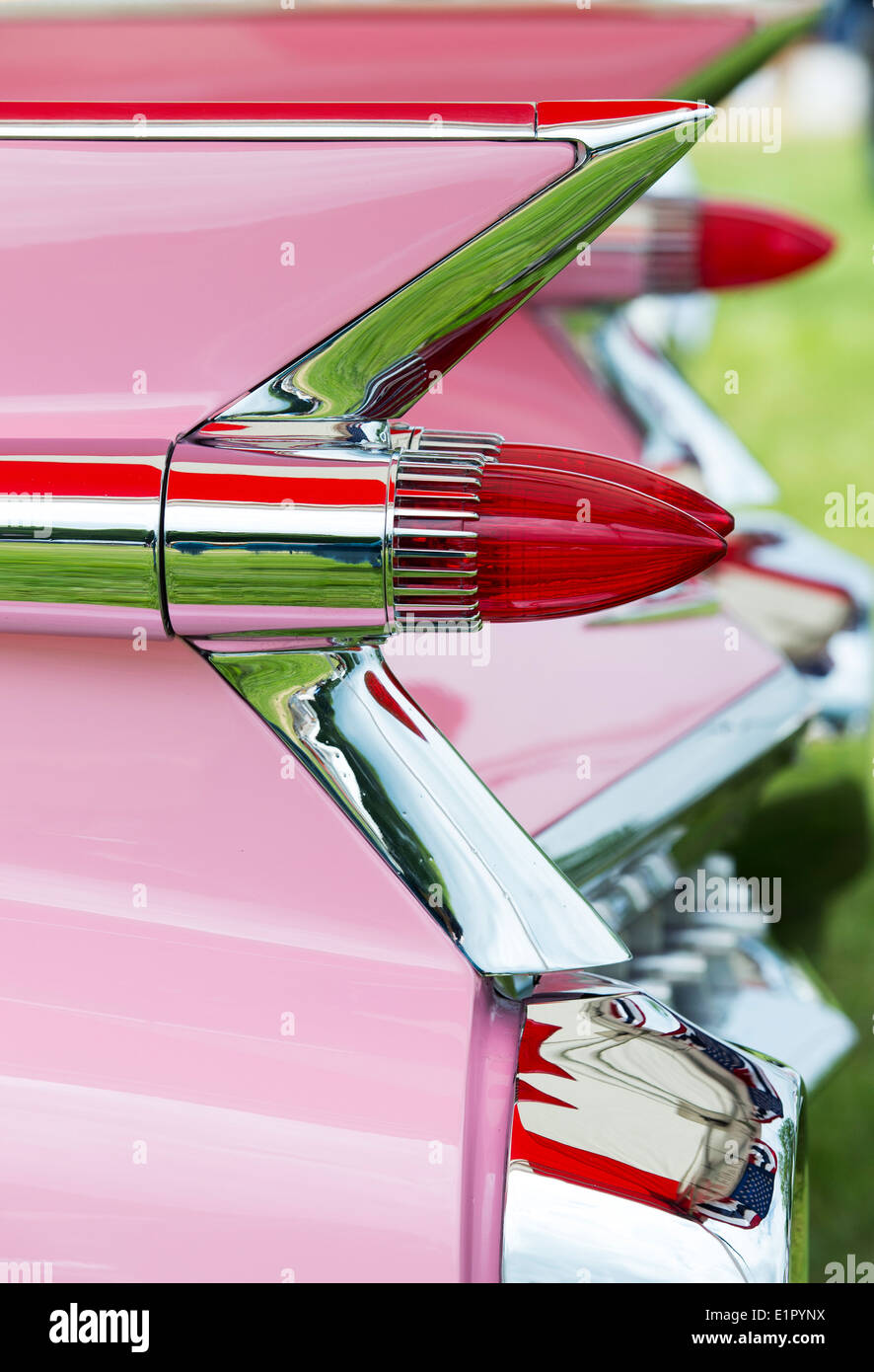 1959 Pink Cadillac Convertible. Sharp tail fin with dual bullet tail ...