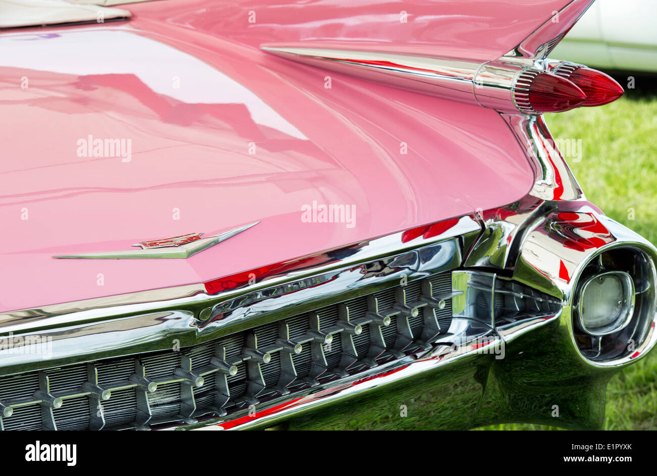 1959 Pink Cadillac Convertible. Sharp tail fin with dual bullet tail ...