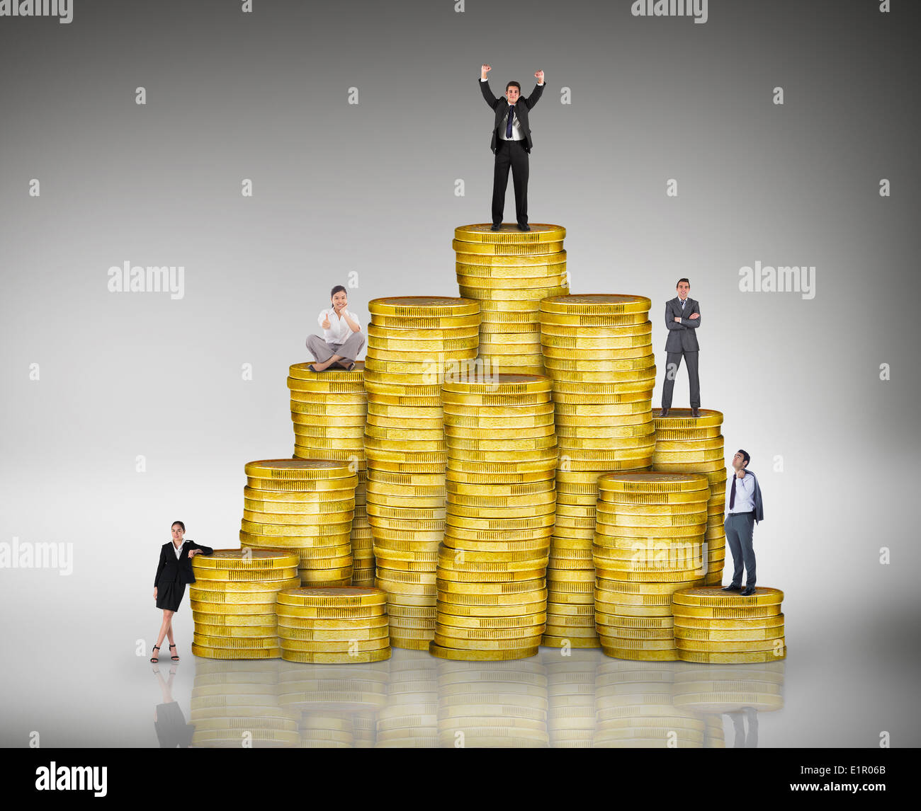 Composite image of business people on pile of coins Stock Photo - Alamy