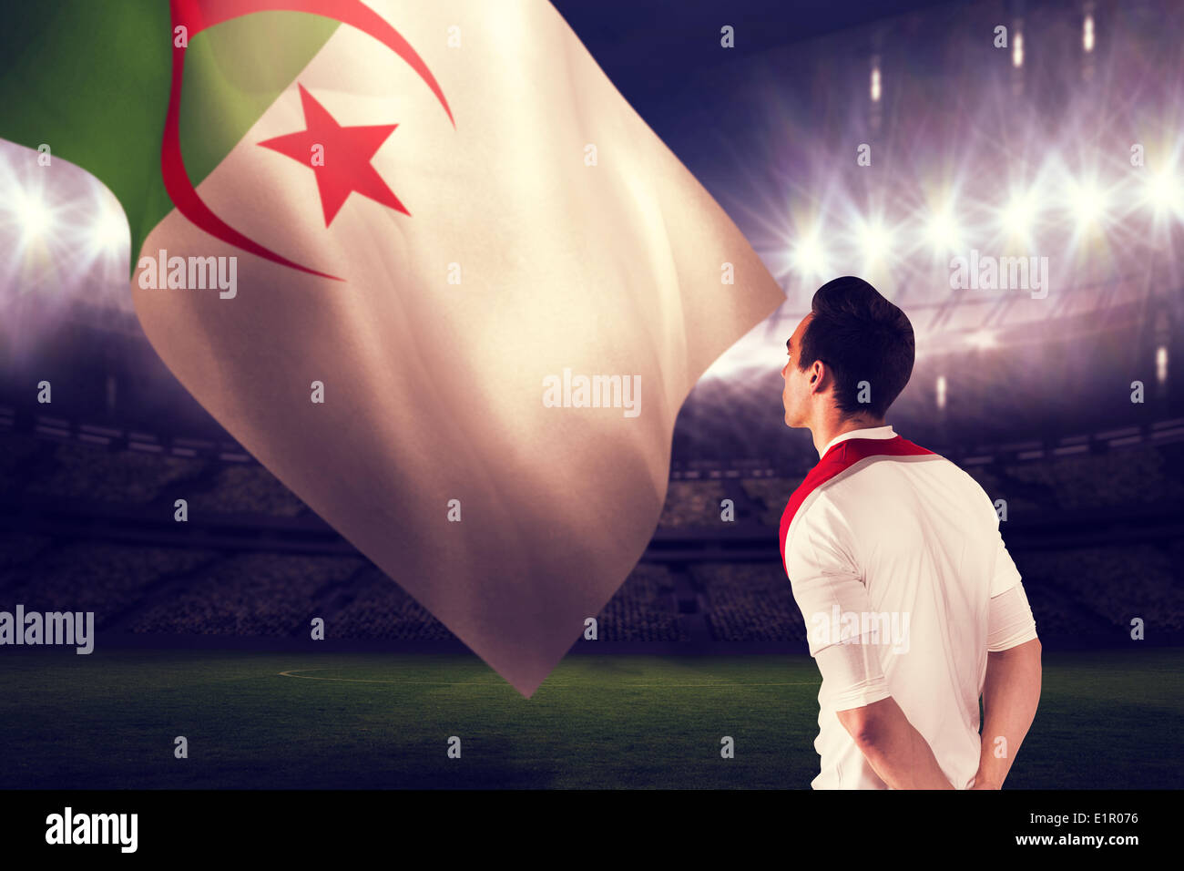 Composite image of handsome football fan looking ahead Stock Photo - Alamy