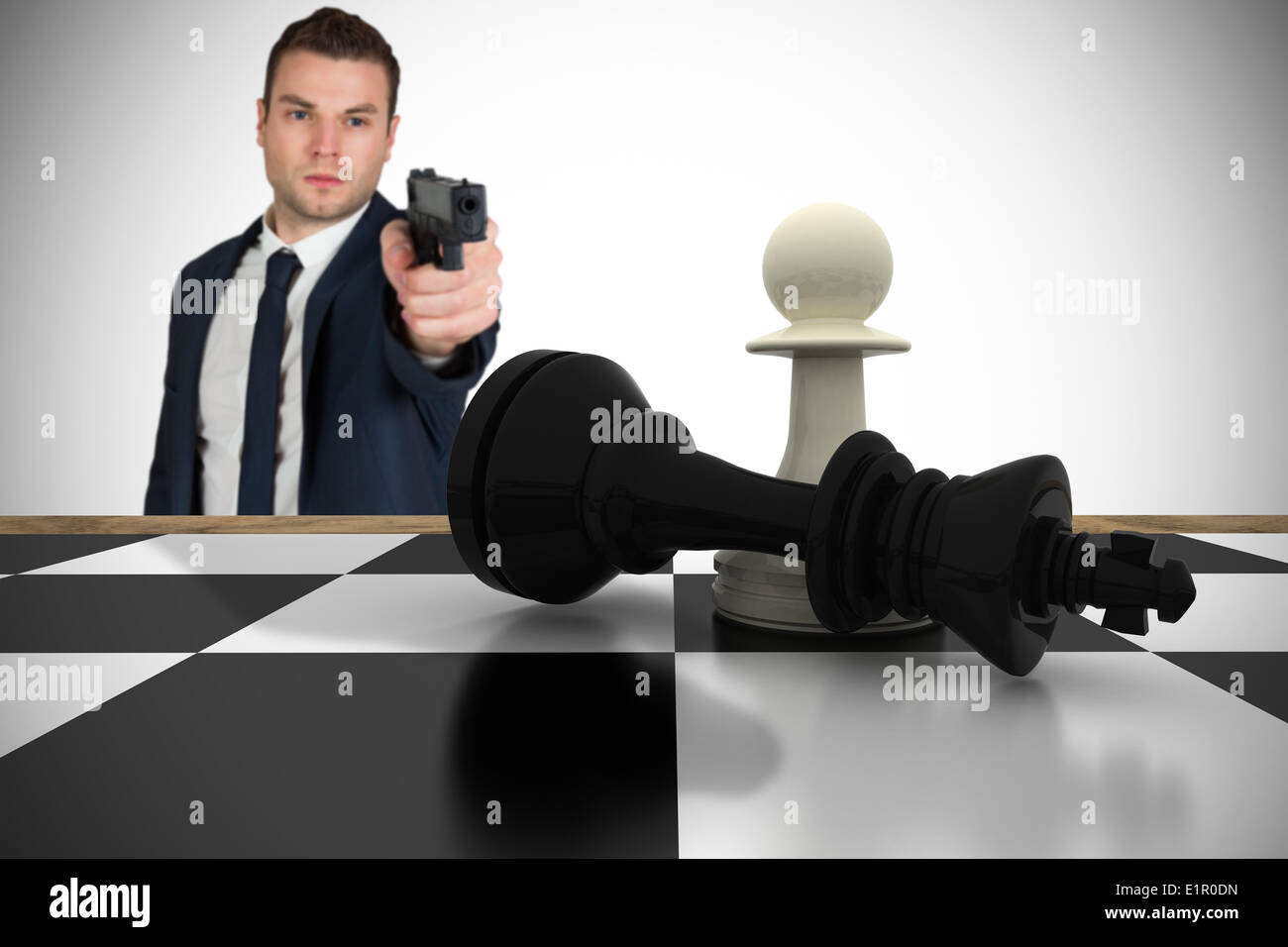 Composite image of serious businessman pointing a gun at chess piece ...
