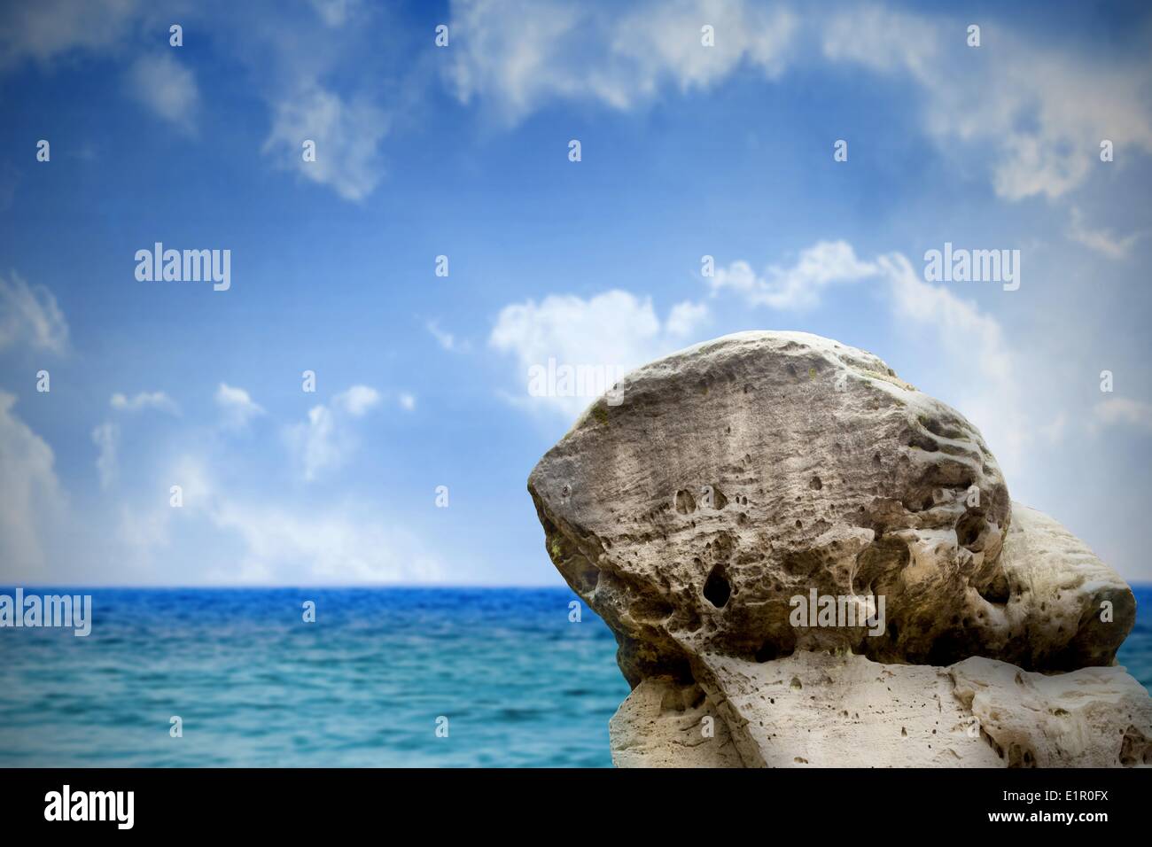 Large rock overlooking sea and sky Stock Photo - Alamy