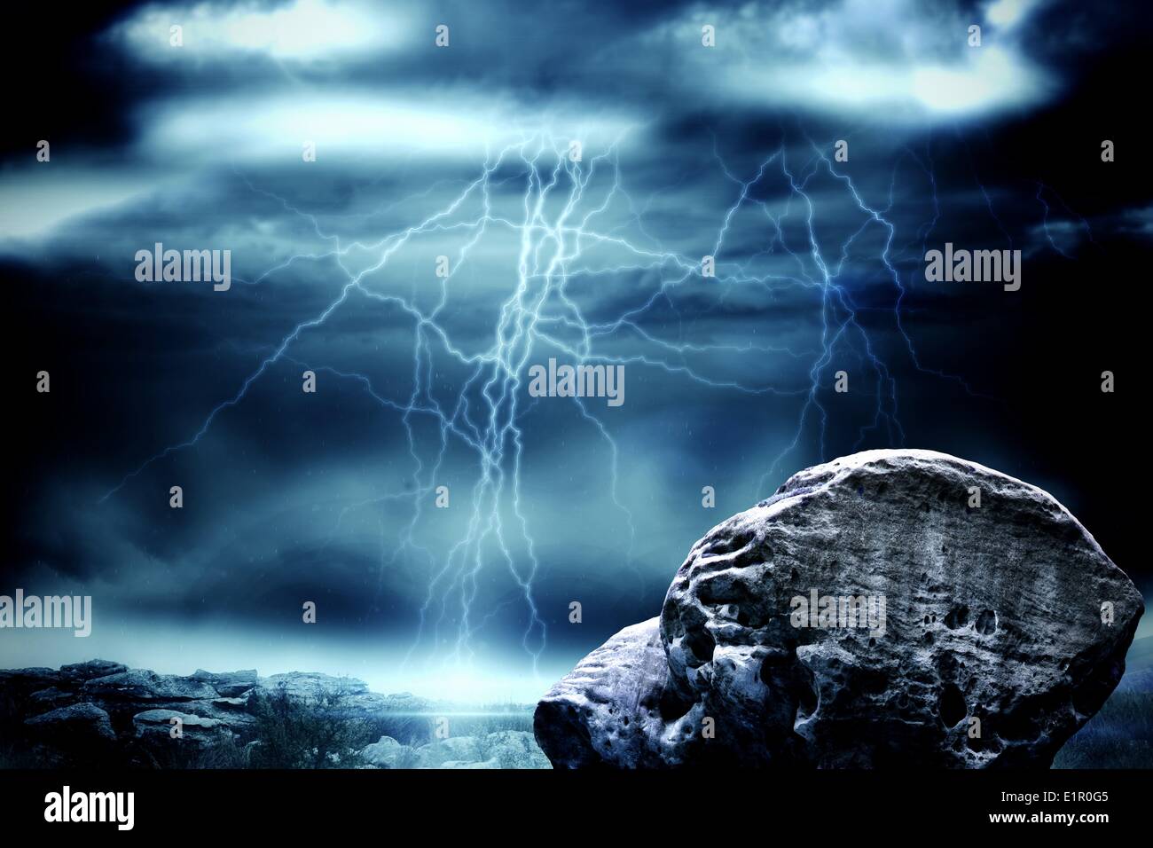 Large rock overlooking stormy sky Stock Photo - Alamy