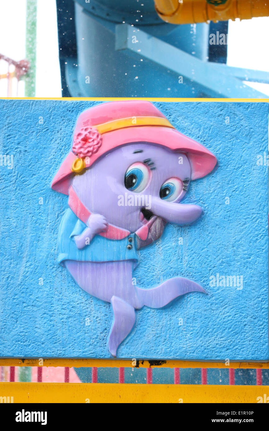 Cartoon fish wearing hat on colorful wall Stock Photo - Alamy