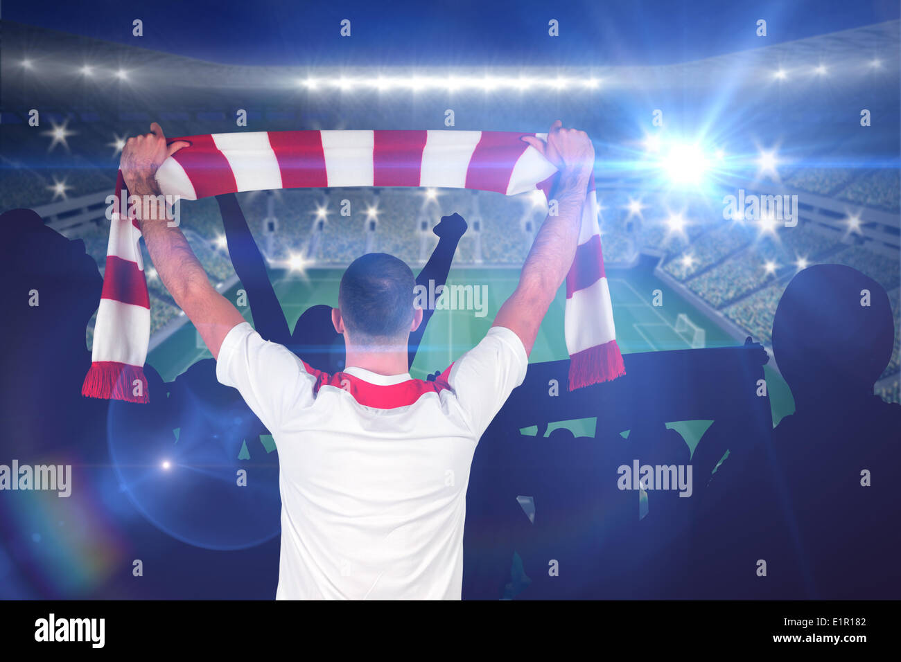 Cheering football fan waving scarf hi-res stock photography and images ...