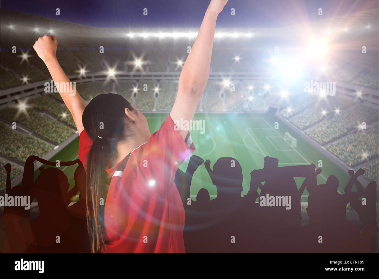 Composite image of excited asian football fan cheering Stock Photo - Alamy