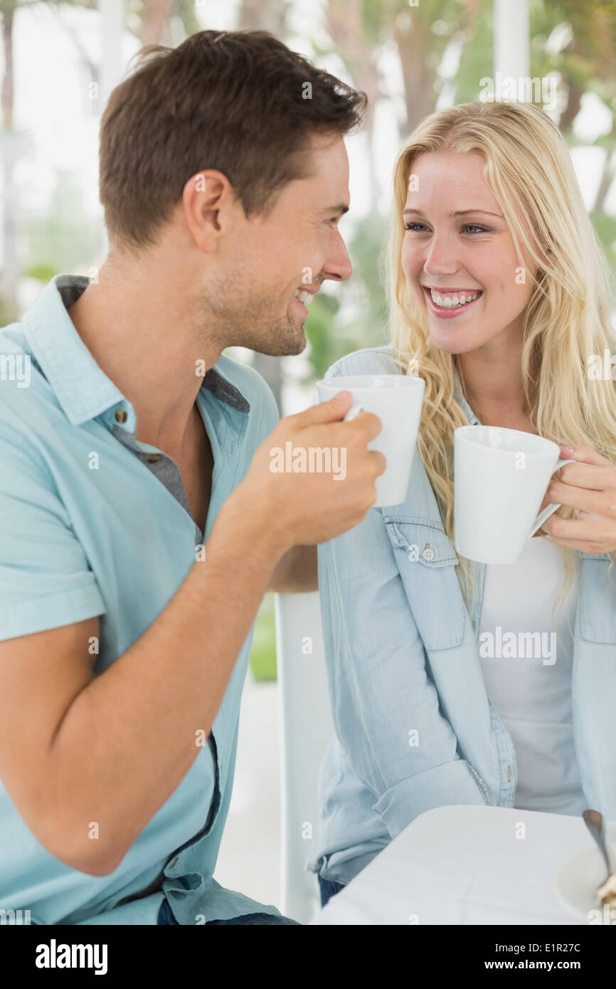 Hip young couple having coffee together Stock Photo - Alamy