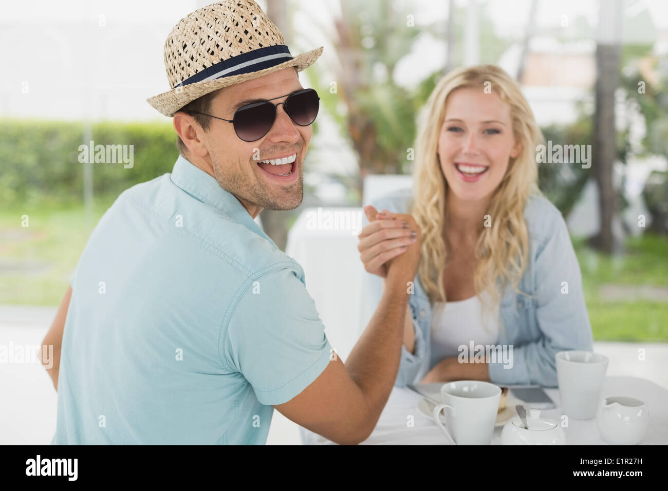 Hip young couple having coffee together Stock Photo - Alamy