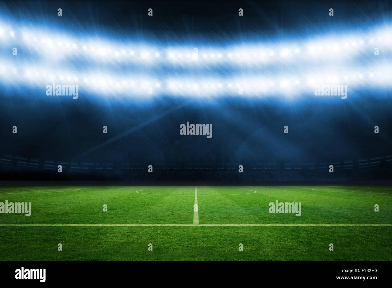 Football pitch under blue lights Stock Photo - Alamy