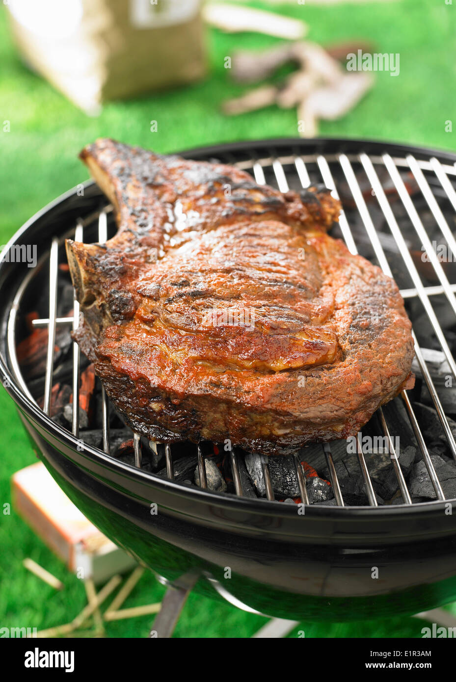 Beef chop on the barbecue outdoors Stock Photo - Alamy