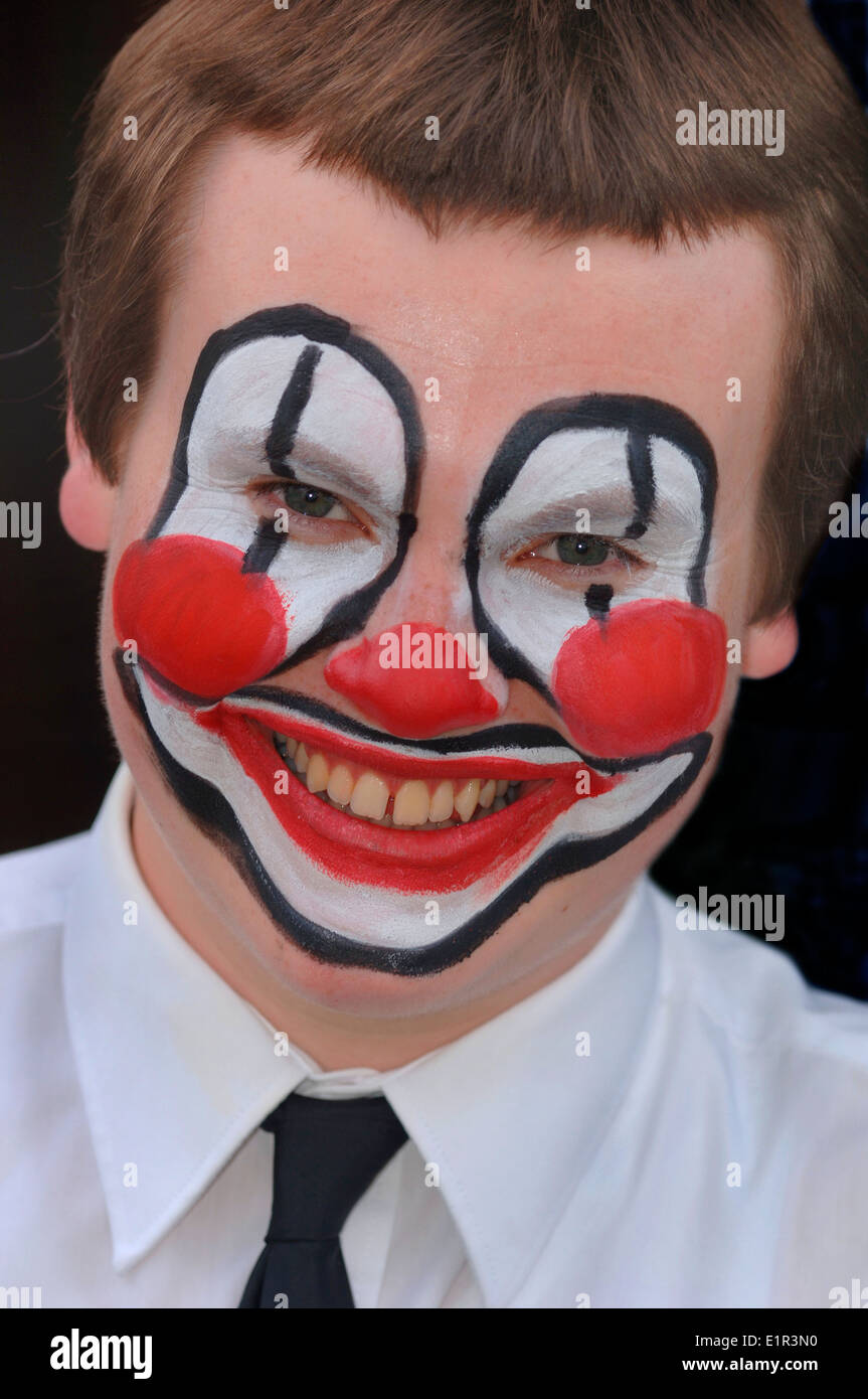 Teenage Man With A Painted Clowns Face Stock Photo - Alamy