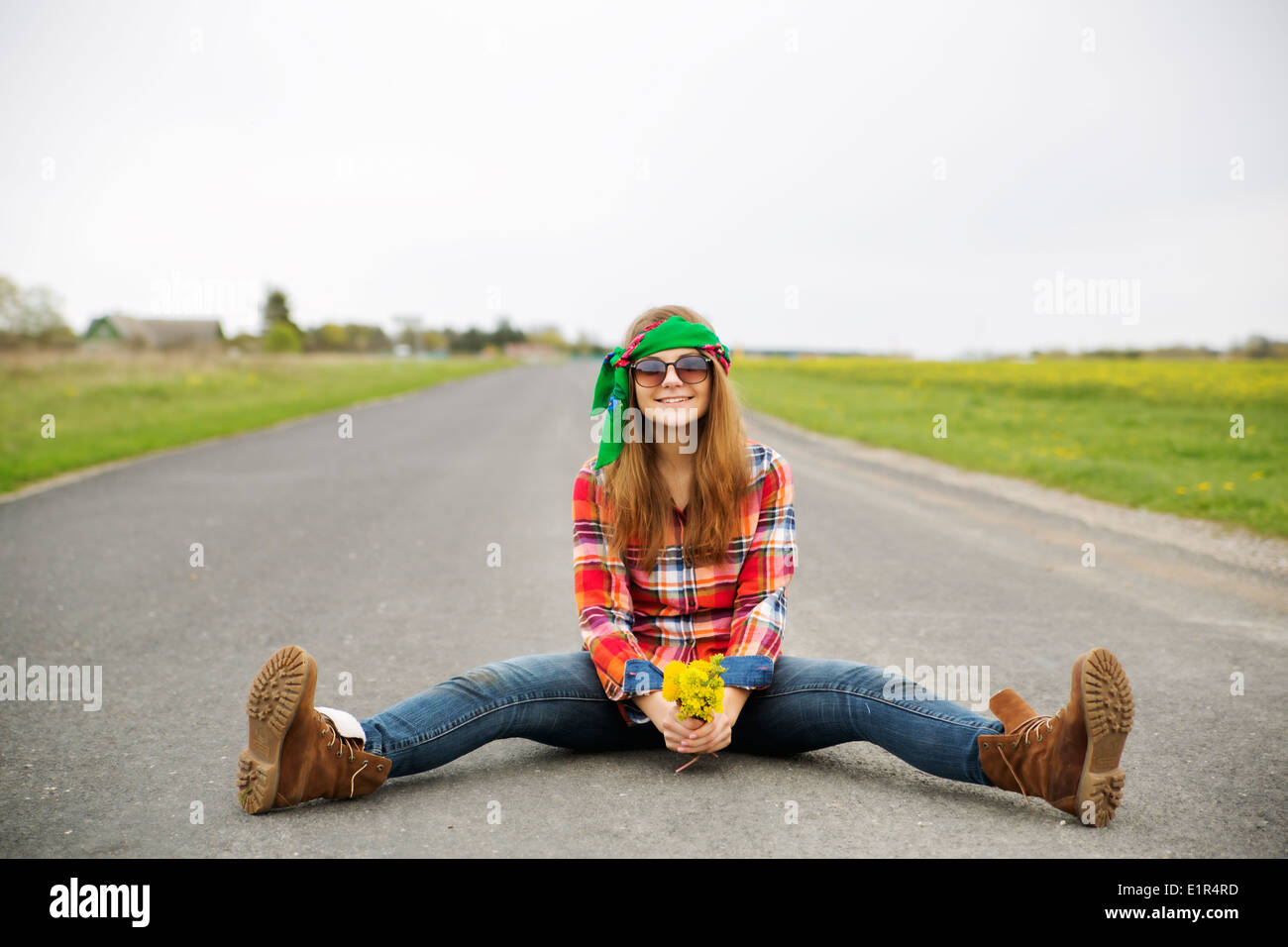 Young woman with flowers and legs pulled apart Stock Photo - Alamy