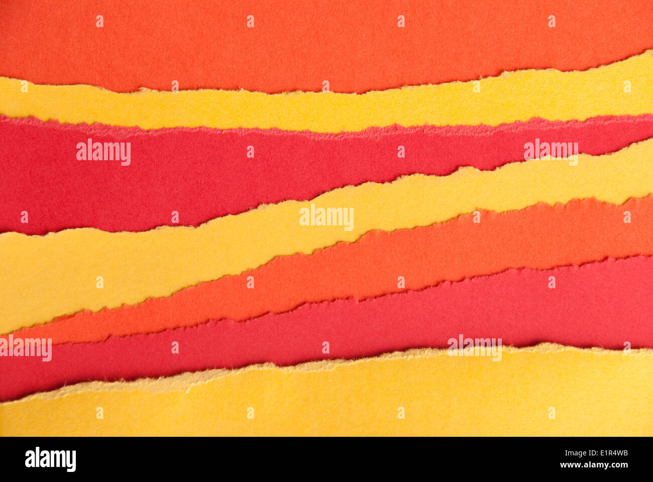 Ripped Red and Orange and Yellow Paper in Stripes as a Paper Background ...