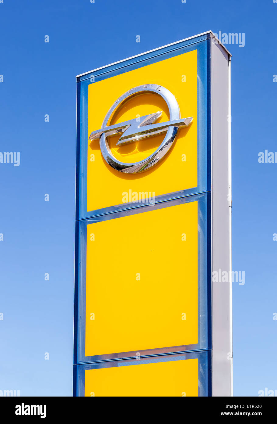 Opel dealership sign against blue sky Stock Photo - Alamy