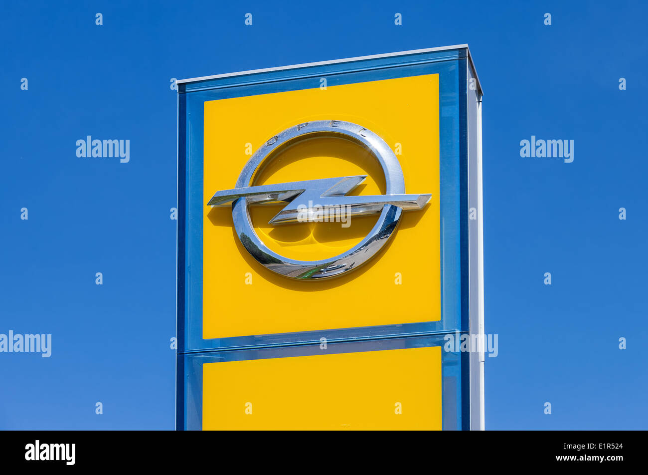 Opel dealership sign against blue sky Stock Photo - Alamy