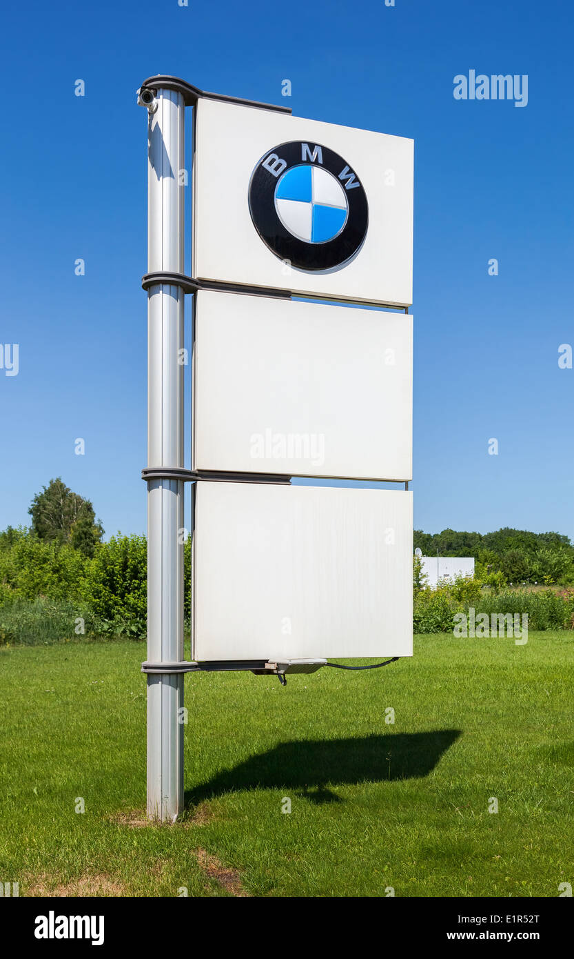 BMW dealership sign against blue sky Stock Photo - Alamy
