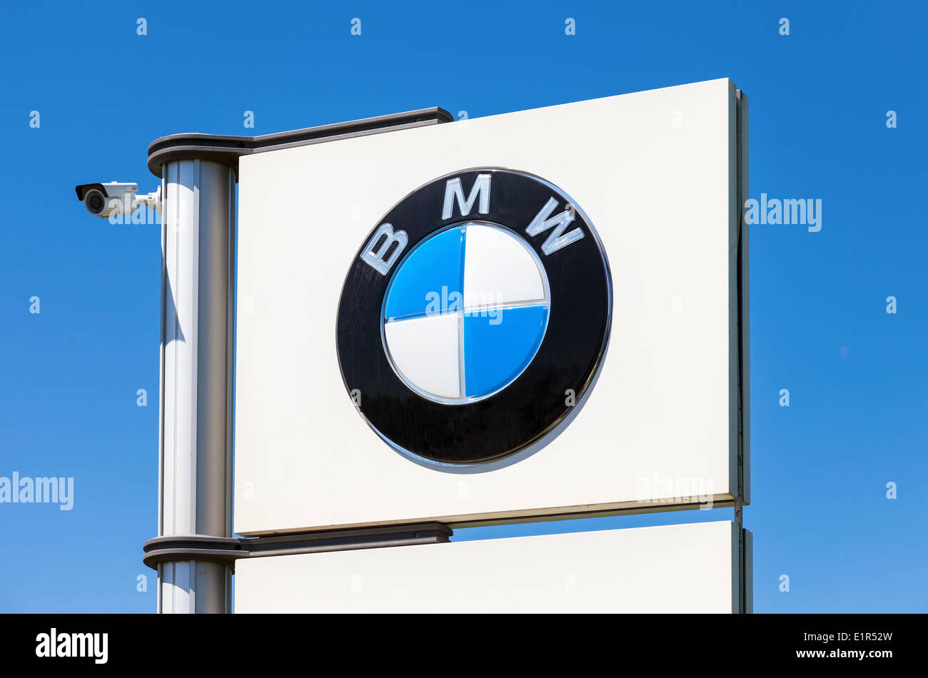 BMW dealership sign against blue sky Stock Photo - Alamy