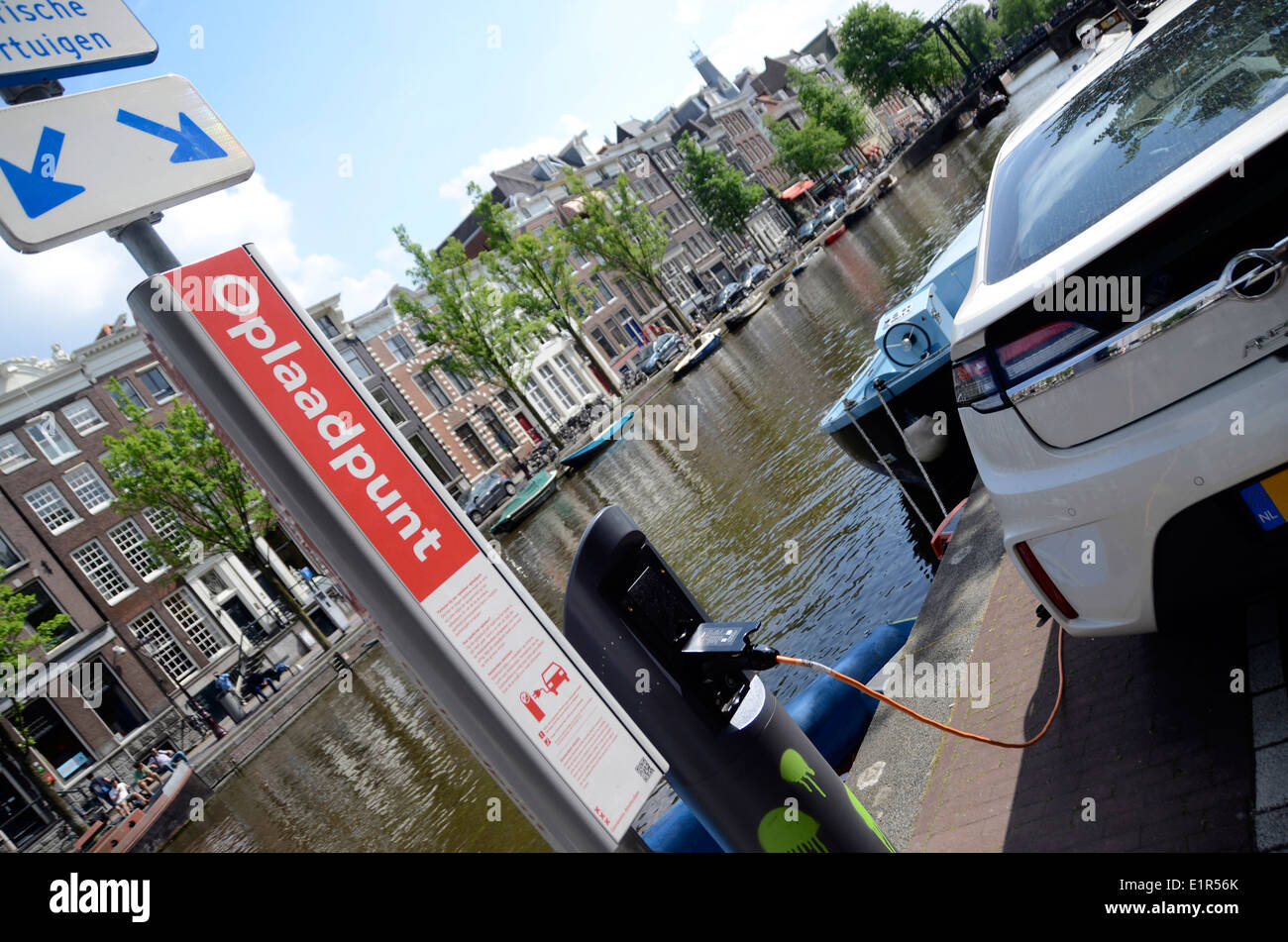 Electric car being recharged at electric charging point in Amsterdam ...