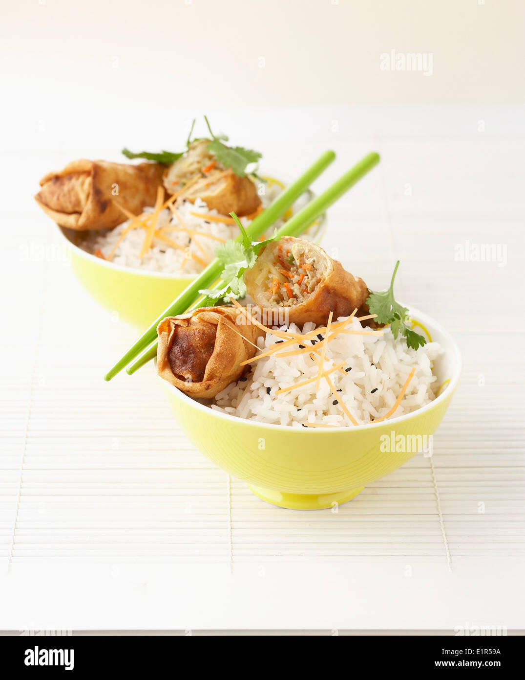 Crisp nems and white rice with black sesame seeds Stock Photo - Alamy