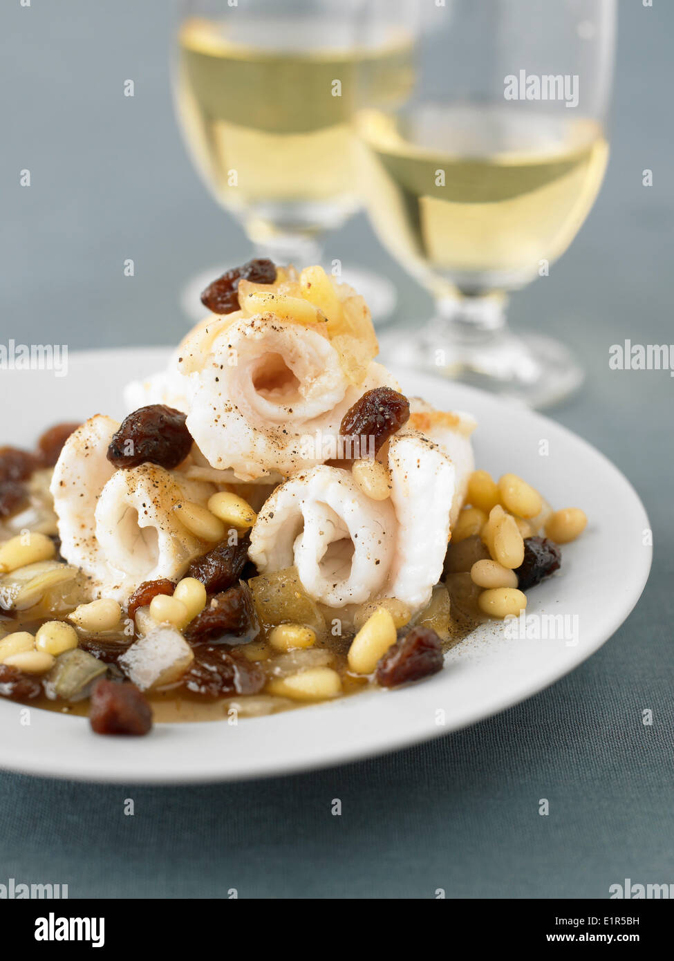 Rolled sole fillets with pine nuts and raisins Stock Photo - Alamy