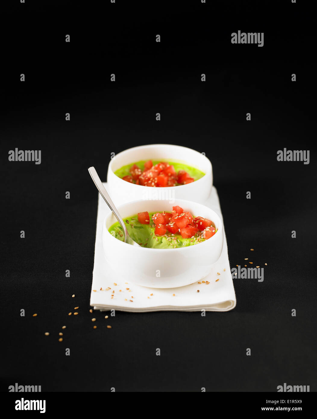 Avocado panna cotta with diced tomatoes and sesame Stock Photo - Alamy