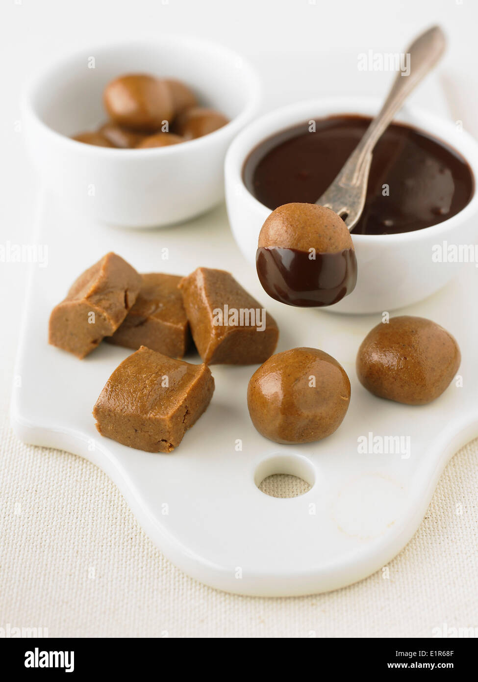 Almond-flavored chocolate bites Stock Photo - Alamy