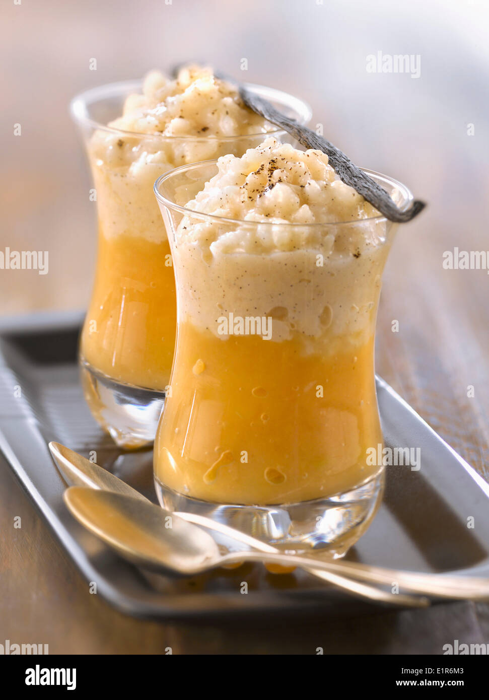 Vanilla-flavored rice pudding with stewed quince Stock Photo - Alamy