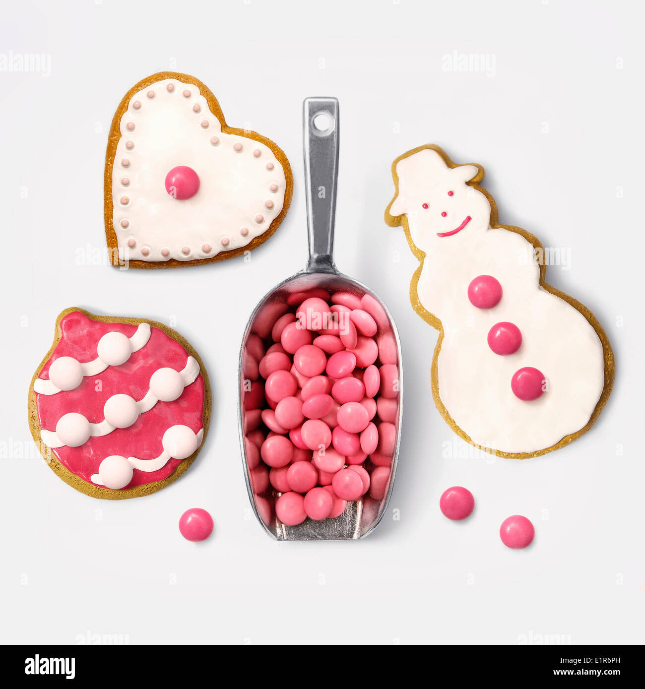 Christmas cookies decorated with pink Smarties Stock Photo - Alamy