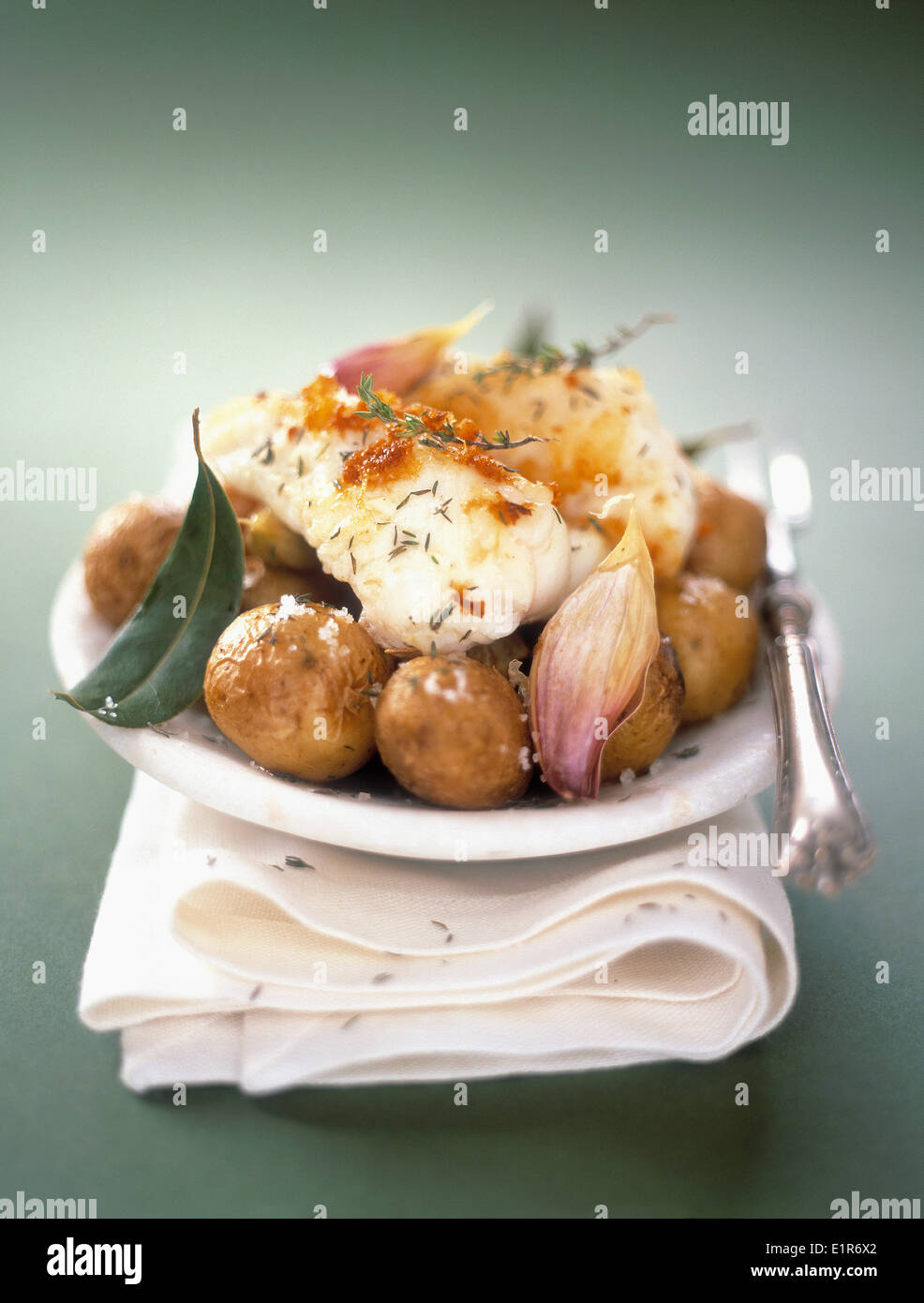 Monkfish roasted with thyme and Grenaille potatoes Stock Photo - Alamy