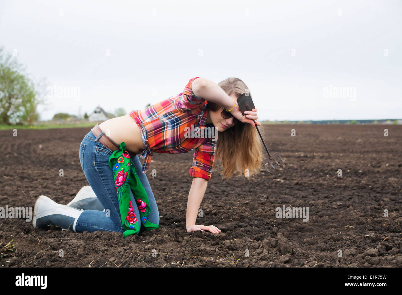 Woman digging dirt hi-res stock photography and images - Alamy