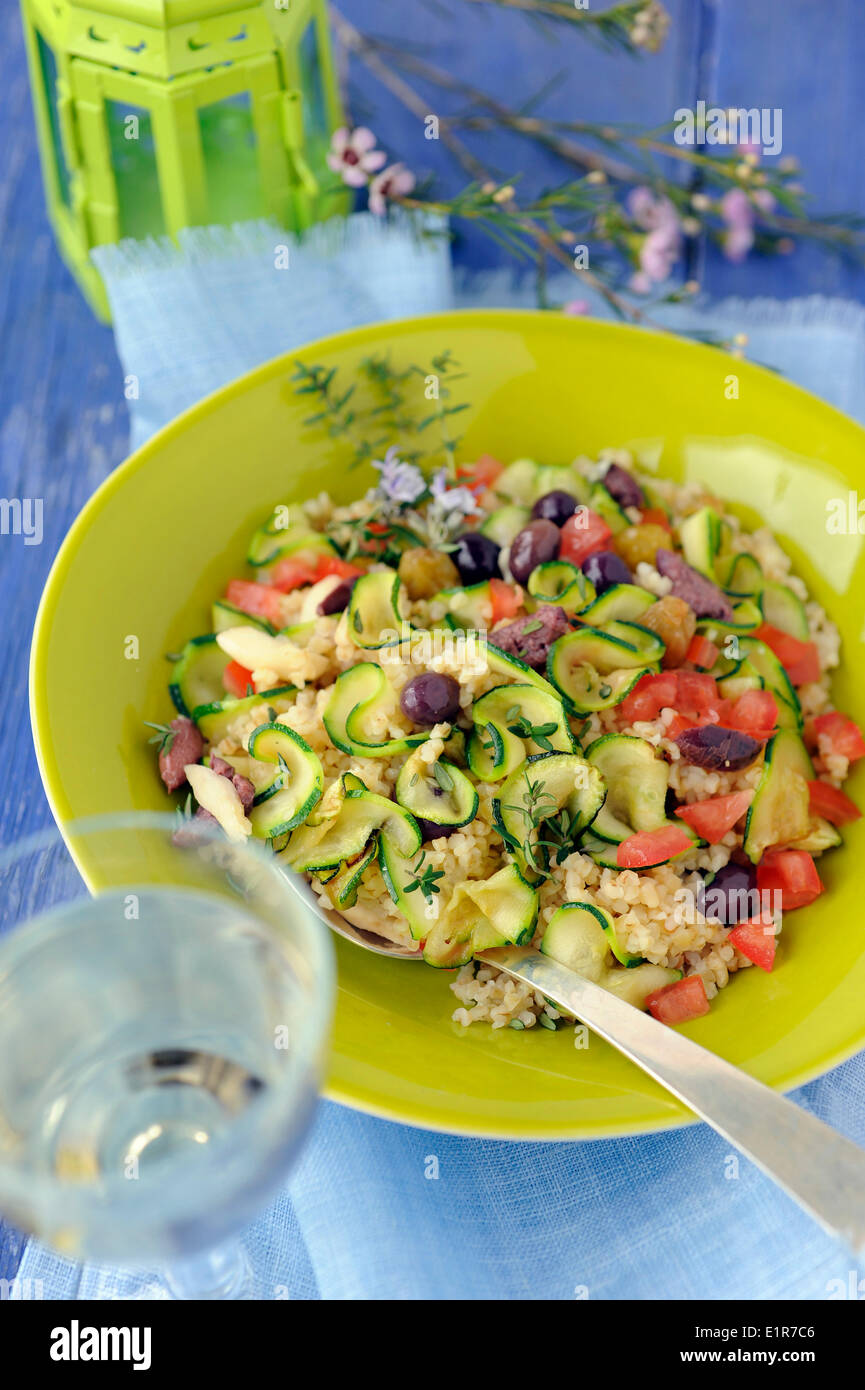 Bulghour,zucchini,tomato,olive and sultana salad Stock Photo - Alamy