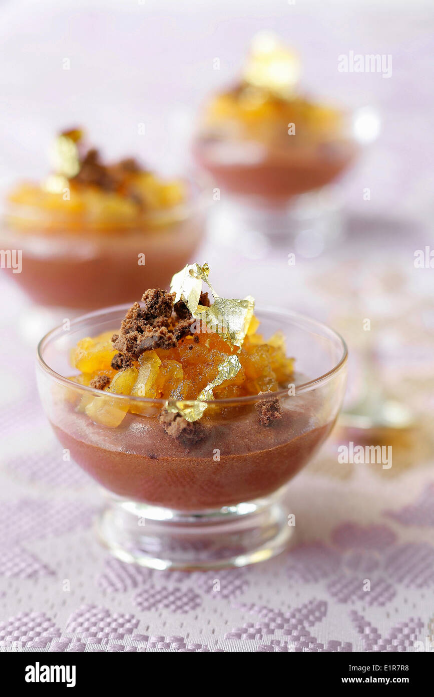 Chocolate mousse with stewed mangoes and golden flakes Stock Photo - Alamy