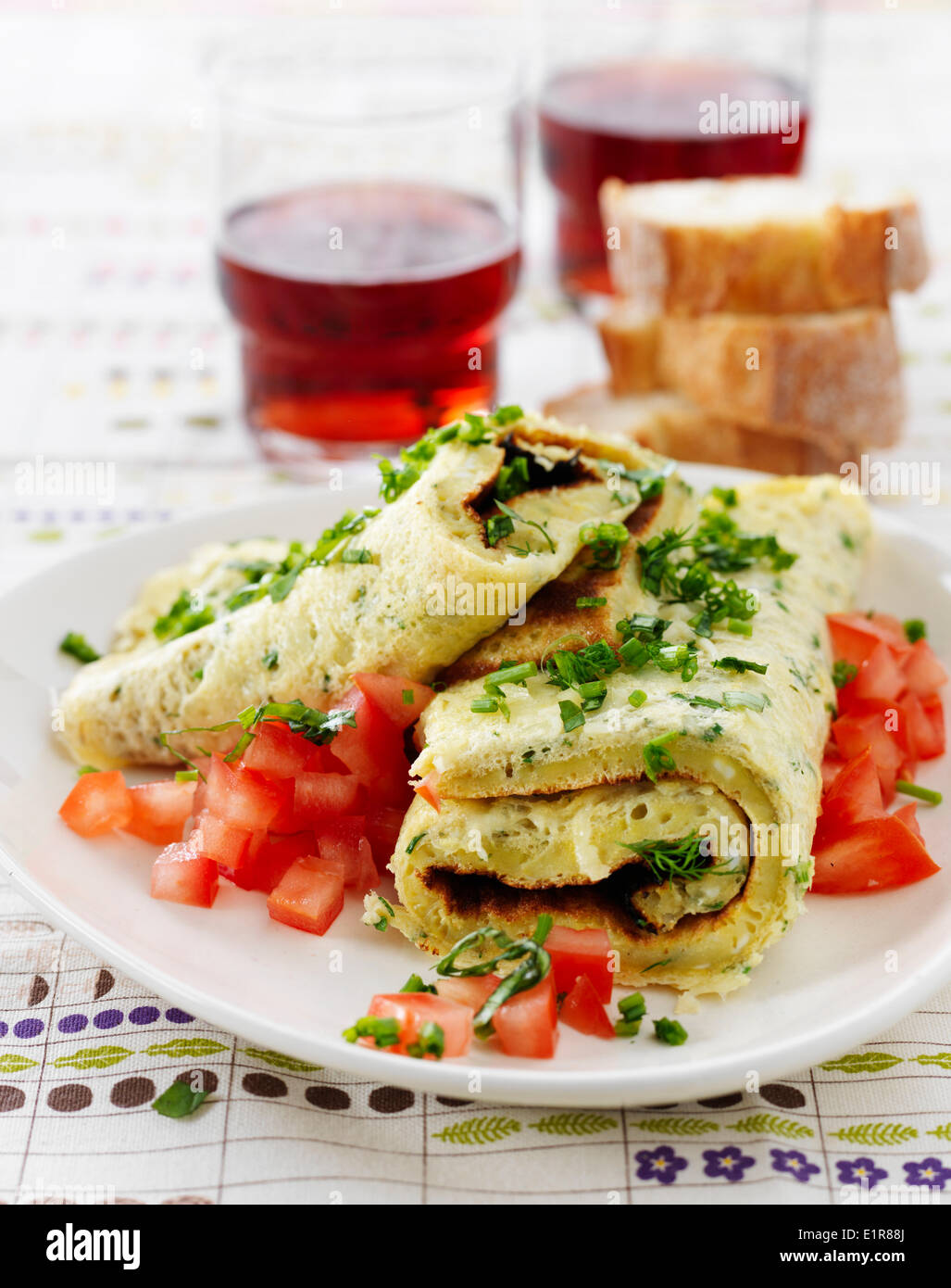 Cheese and herb rolled omelette Stock Photo - Alamy