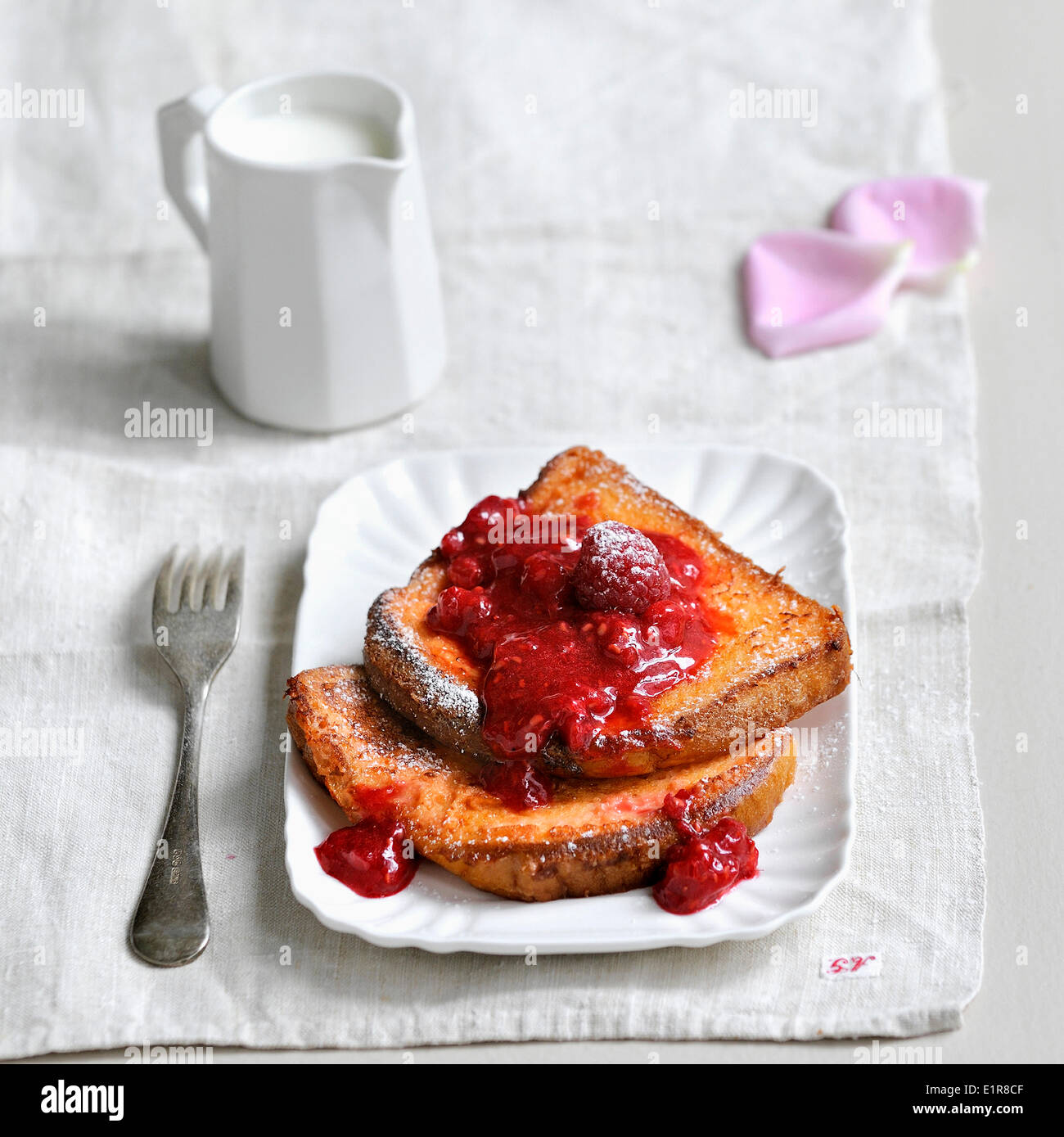 Pink biscuit french toast with stewed summer fruit Stock Photo - Alamy