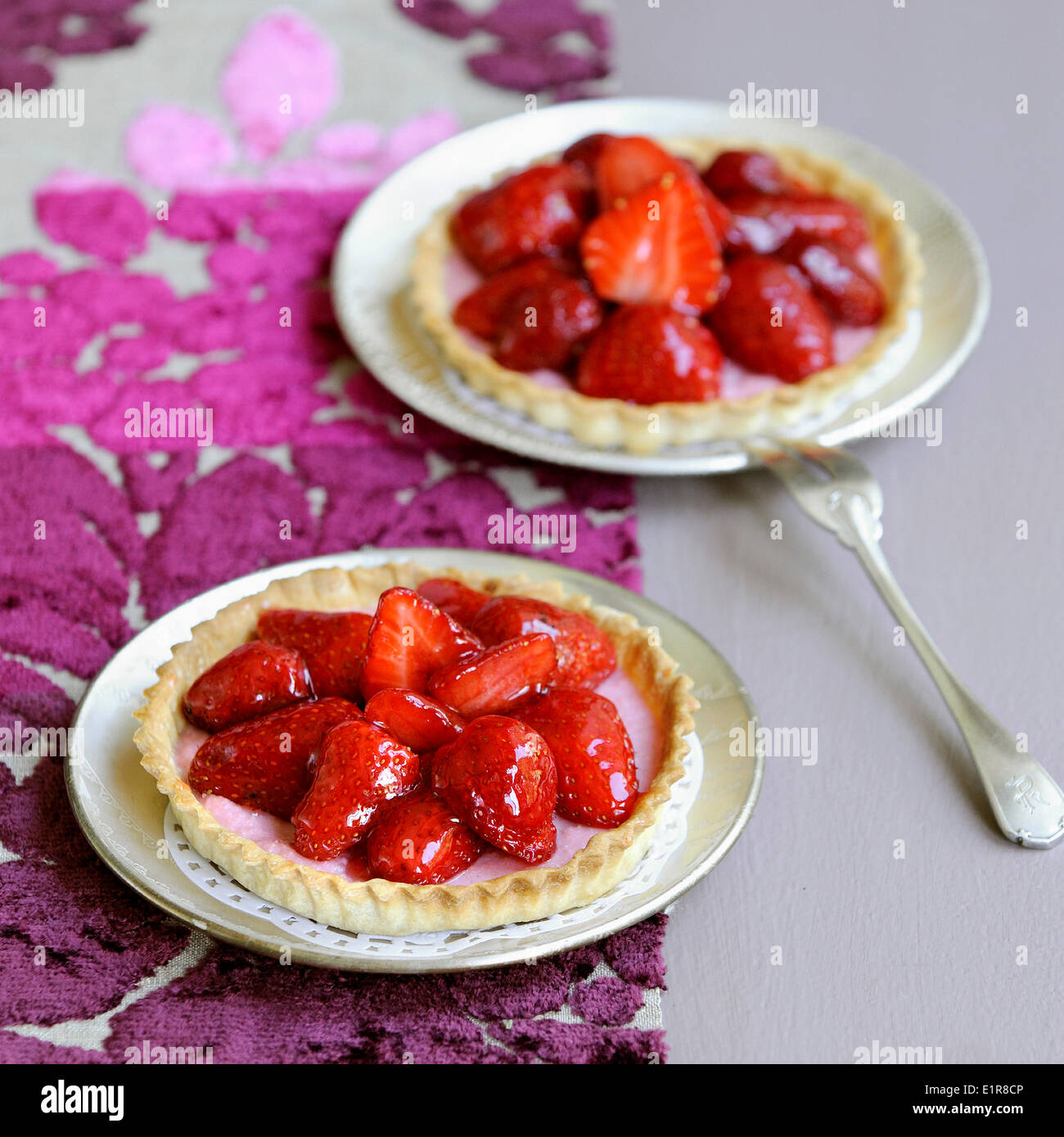 Pink biscuit and strawberry tartlet Stock Photo - Alamy