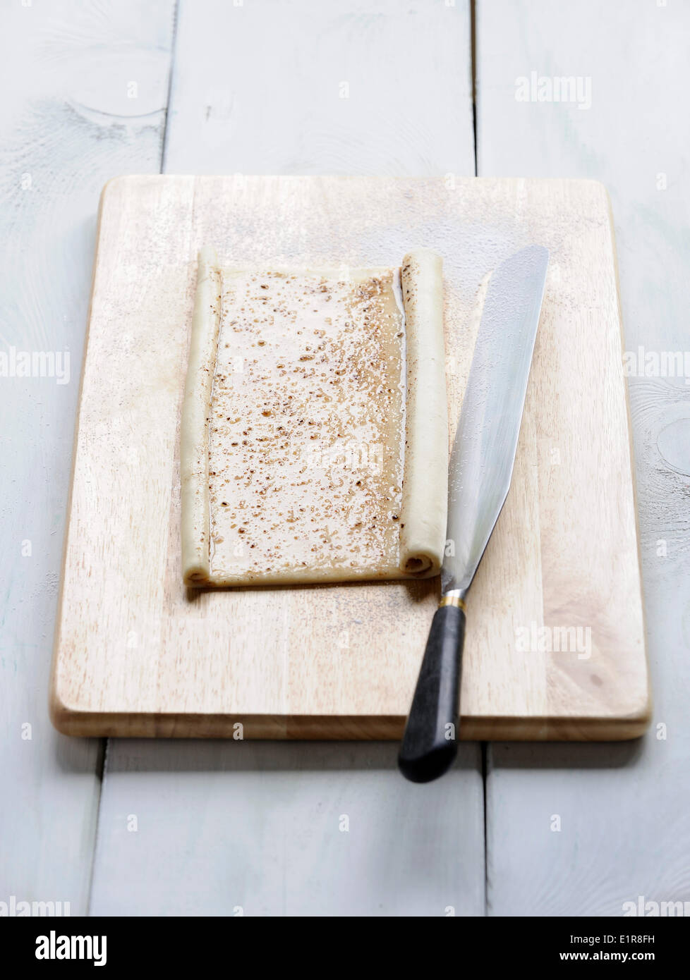 Rolling the uncooked pastry Stock Photo - Alamy