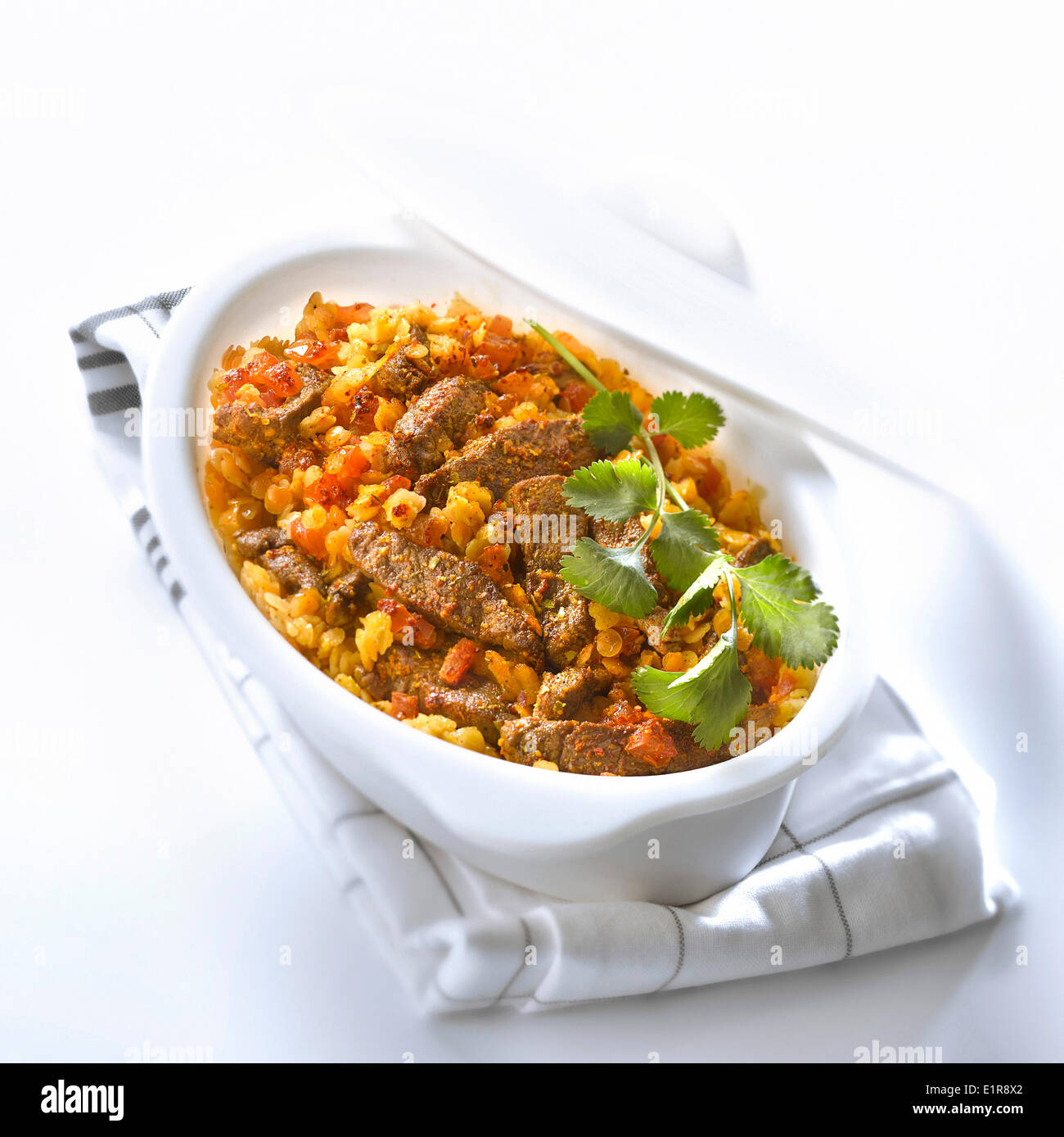 Beef with mild spices and orange lentils Stock Photo - Alamy