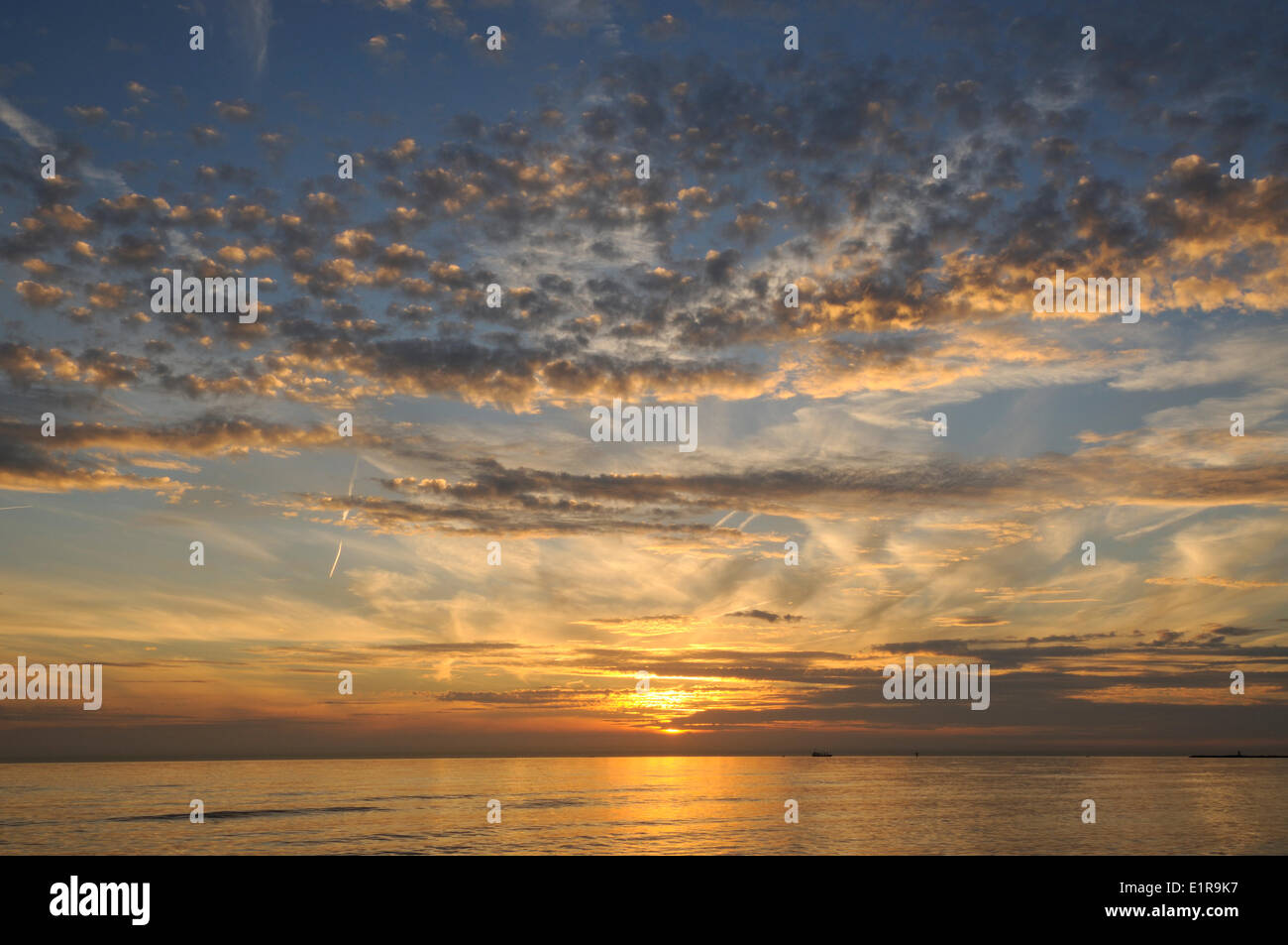 Soft colours during clam sunset above water of North Sea Stock Photo ...