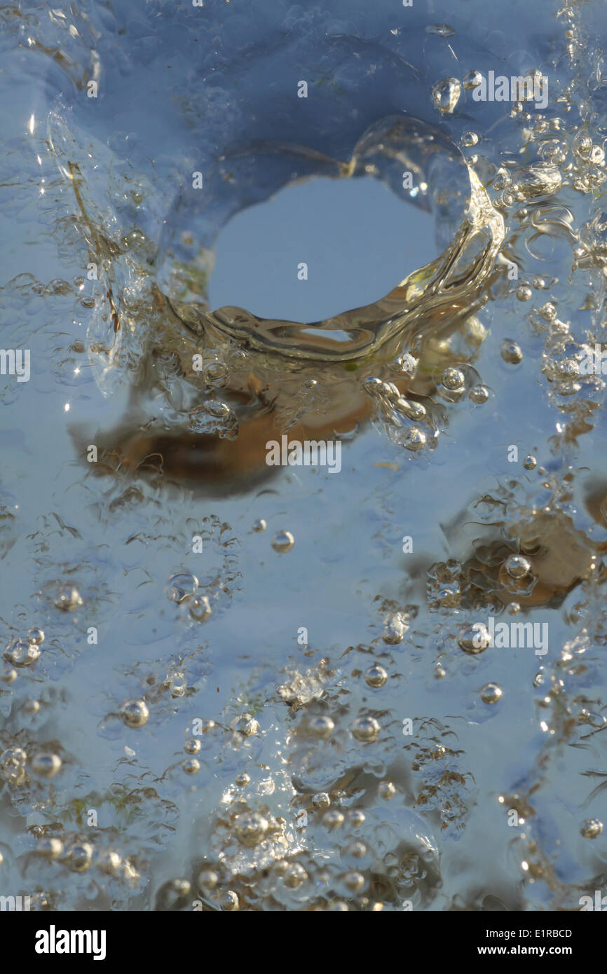 Bubbles into ice, side view Stock Photo - Alamy