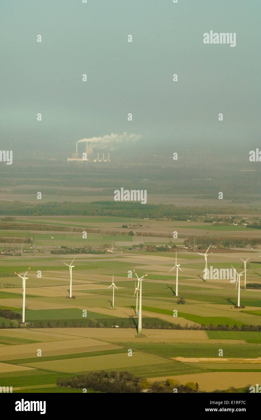 Windmills in countryside with coal energy plant in the distance Stock ...