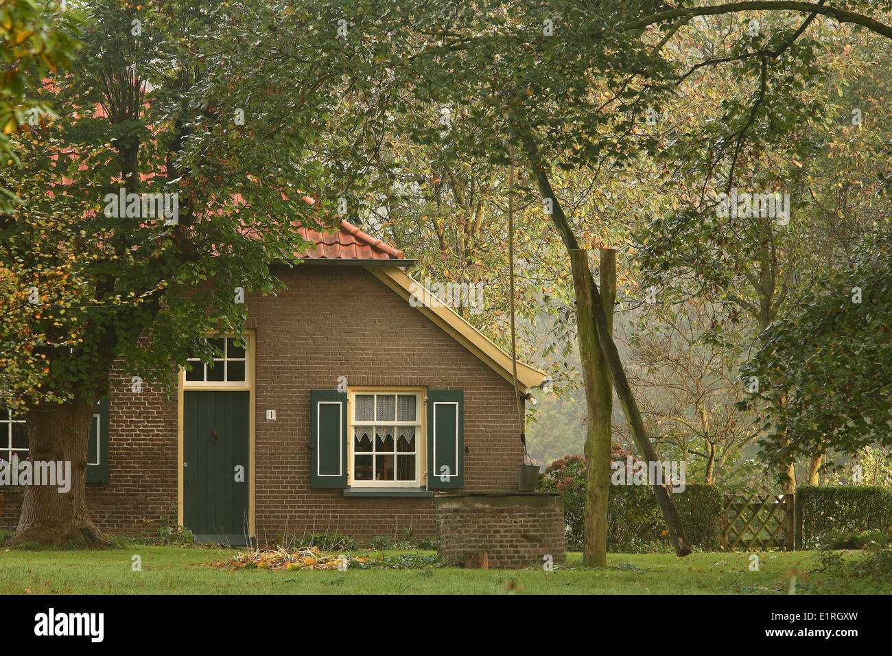 old farm with well Stock Photo - Alamy