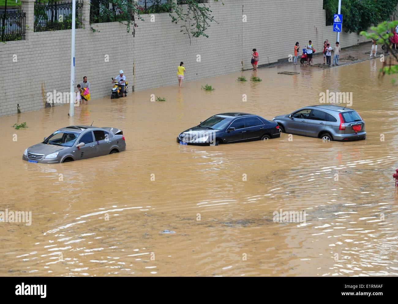 Dahua, China's Guangxi Zhuang Autonomous Region. 9th June, 2014. Cars ...