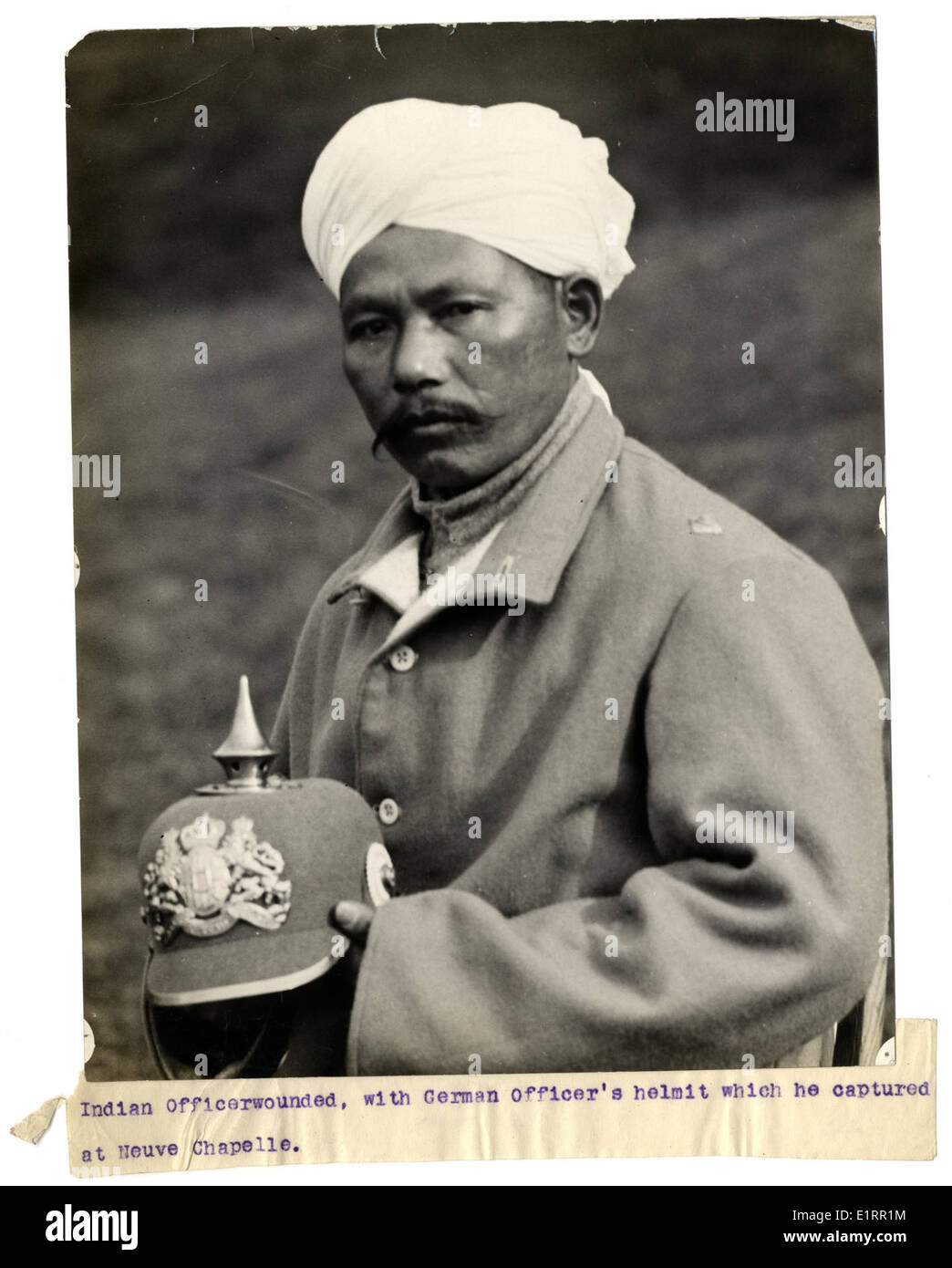 This image shows an Indian officer who was wounded and is holding the ...
